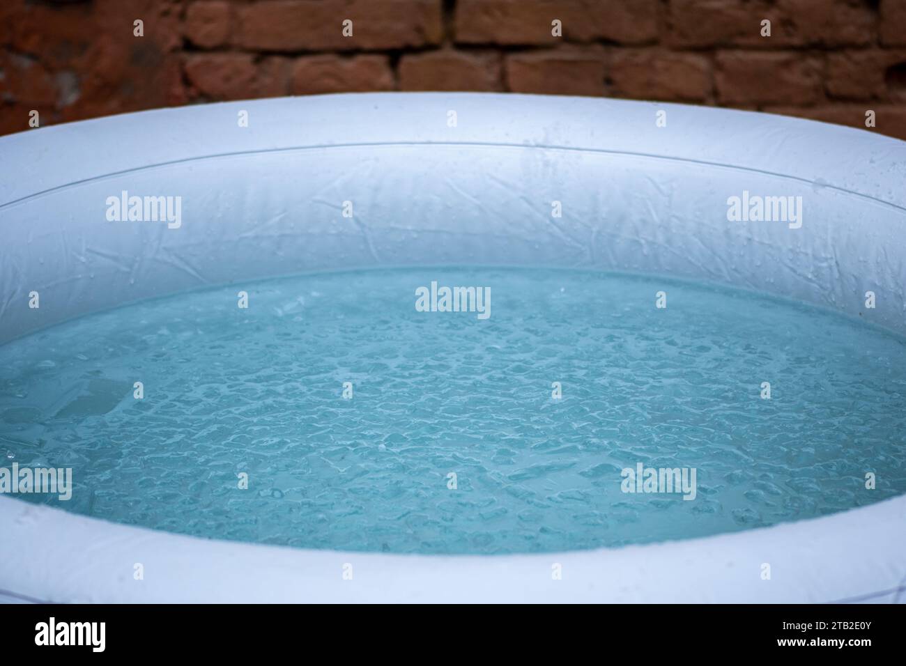 Portable Plastic Inflatable Tub In A Garden Ready For Ice Bathing In The Cold Water Filled With