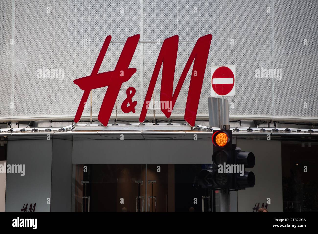 Close up signage of H&M, Hennes & Mauritz store in-front of traffic ...