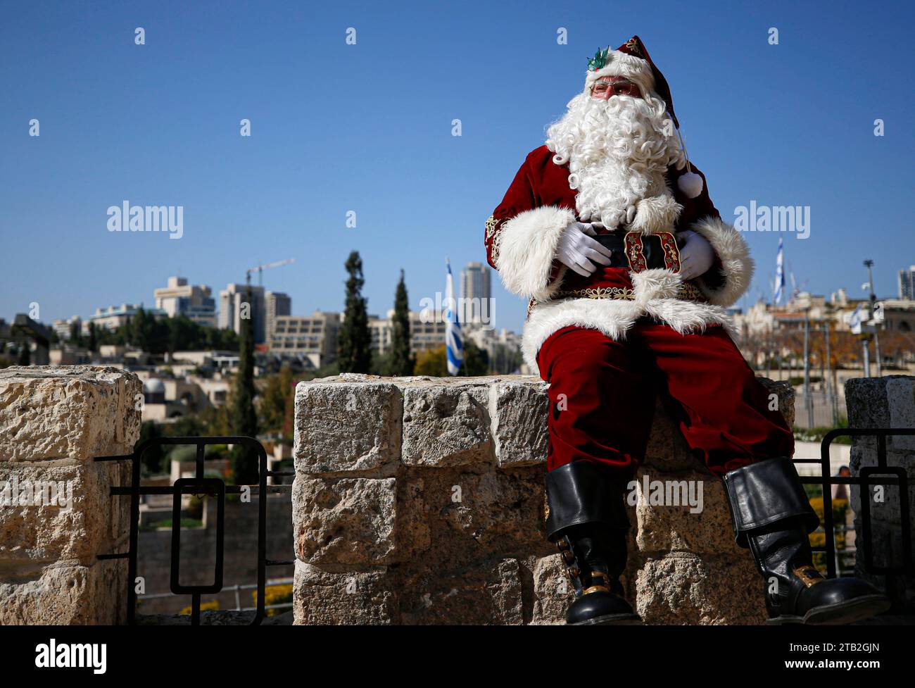 Israel Palestinians Christmas Palestinian Issa Qassisieh, dressed as ...