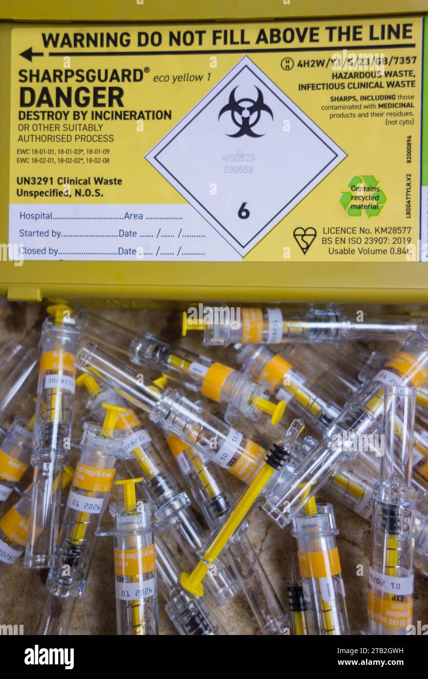 Closeup of Sharpsguard and discarded plastic syringes and needles Stock ...
