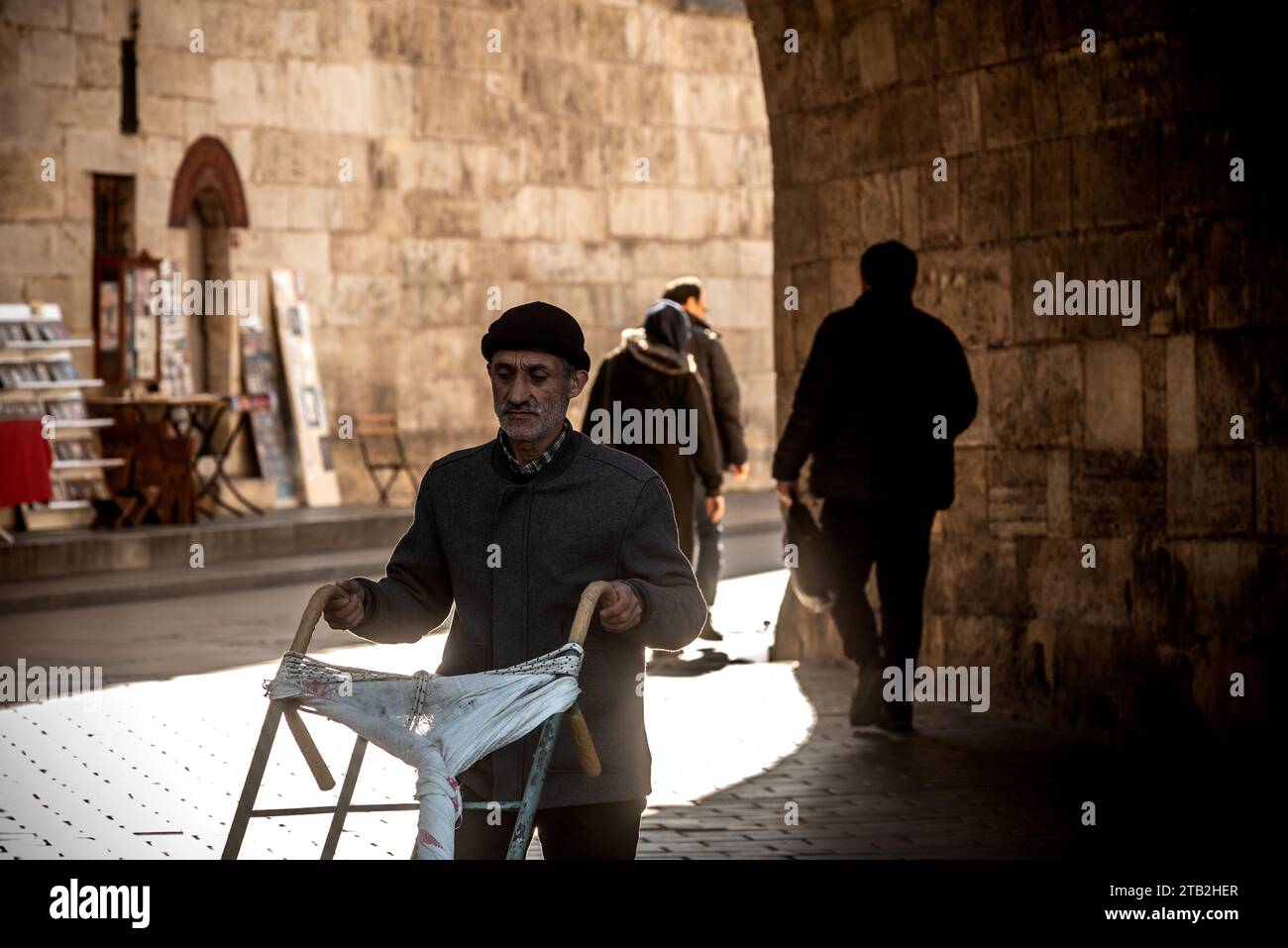 Istanbul, Turkey. November 21st 2023 A Turkish worker pushes a trolley ...