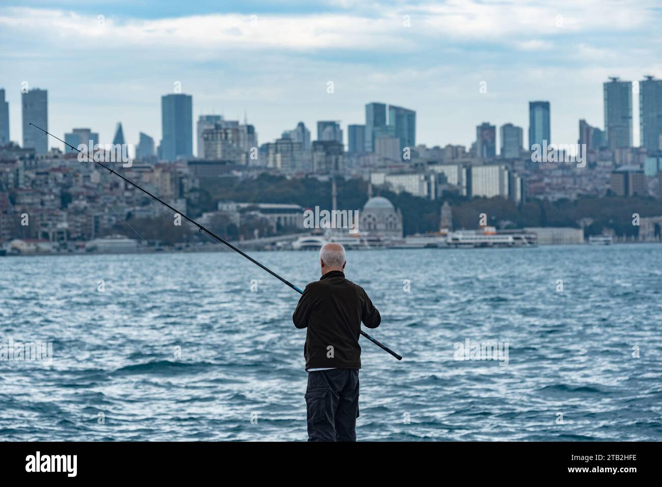 Istanbul, Turkey. November 22nd 2023 An old Turkish man fishing the ...