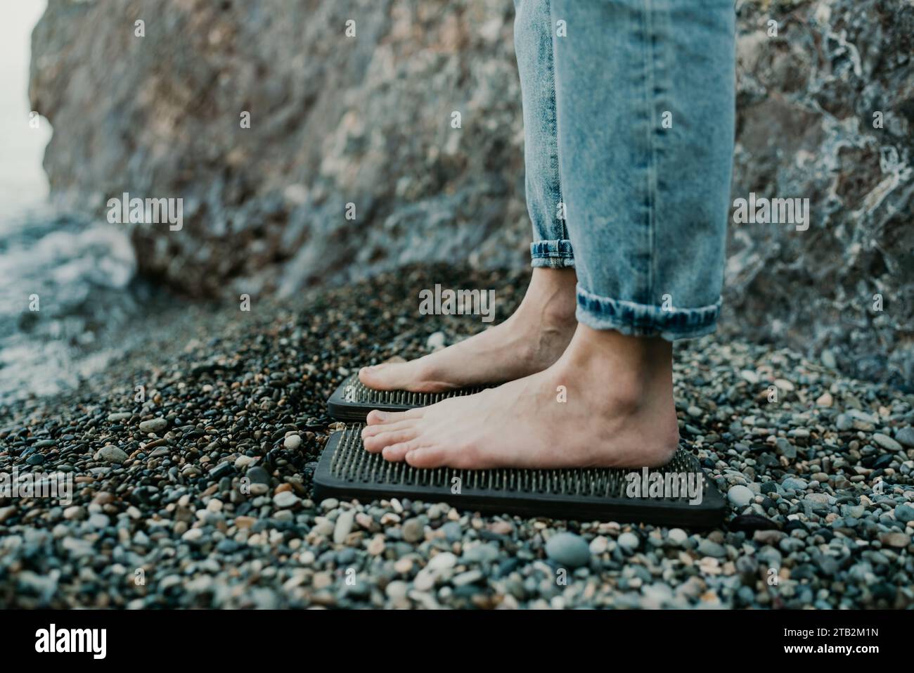 Sea Woman feet stepping on sadhu board during indian practice on the ...