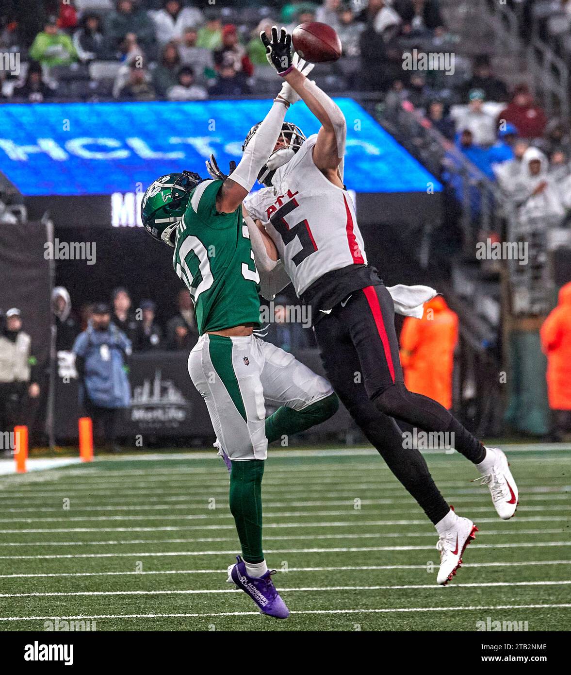 New York Jets cornerback Michael Carter II (30) breaks up a pass ...
