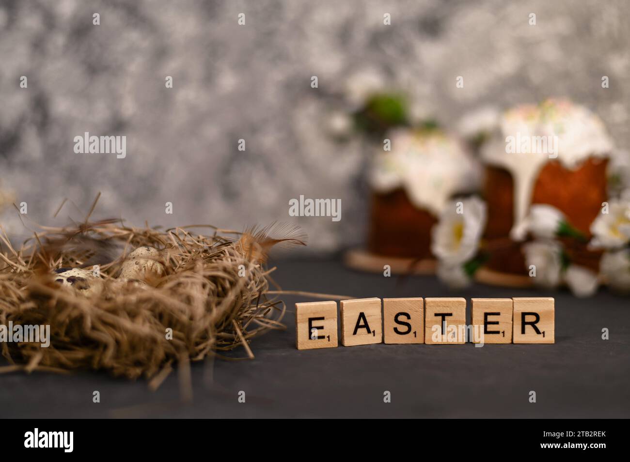 Easter text on wooden tablets. Quail eggs in the nest Stock Photo - Alamy