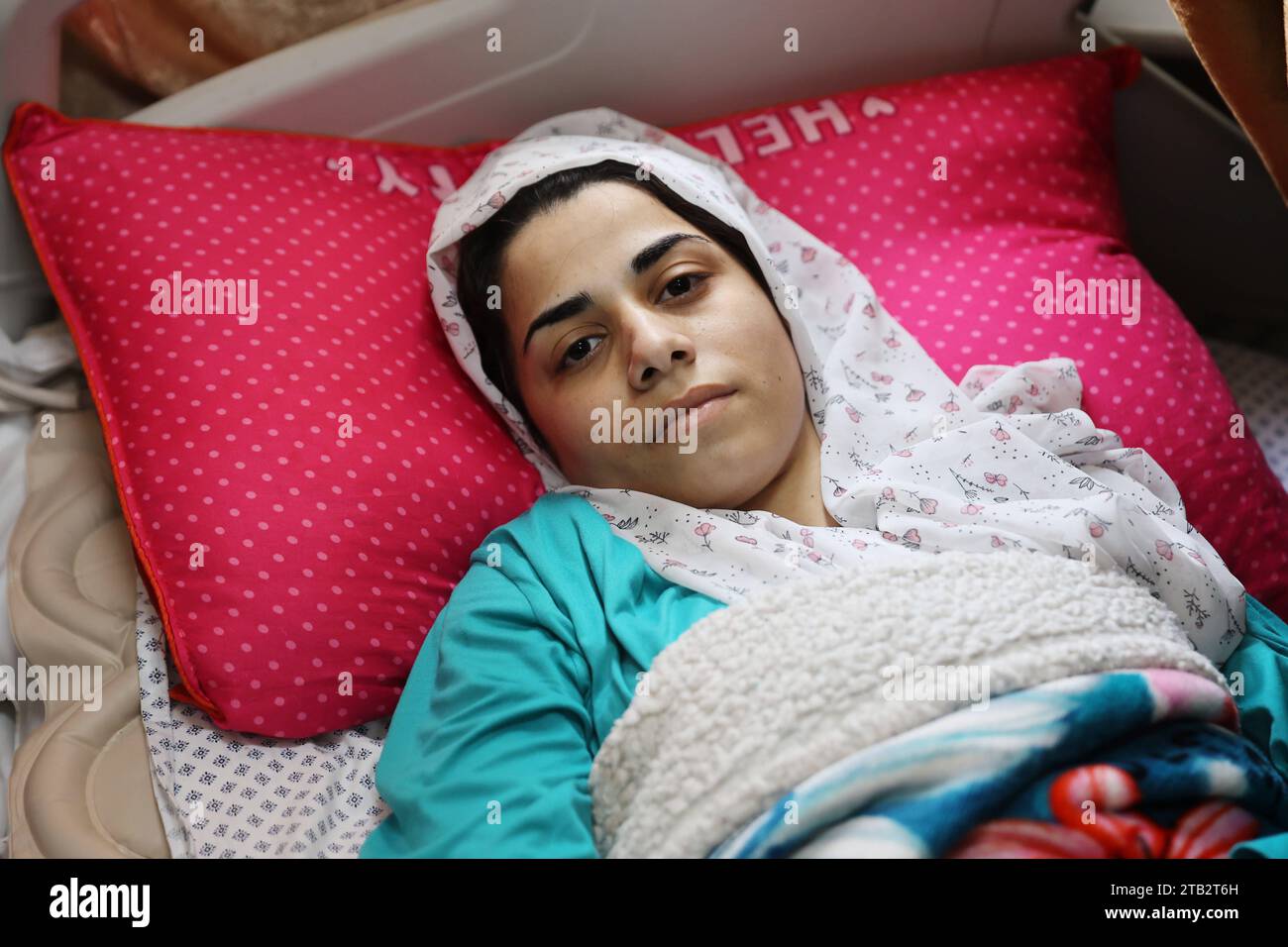 Palestinian Hadeel Mohsen, sitting with her mother and sister in Al ...
