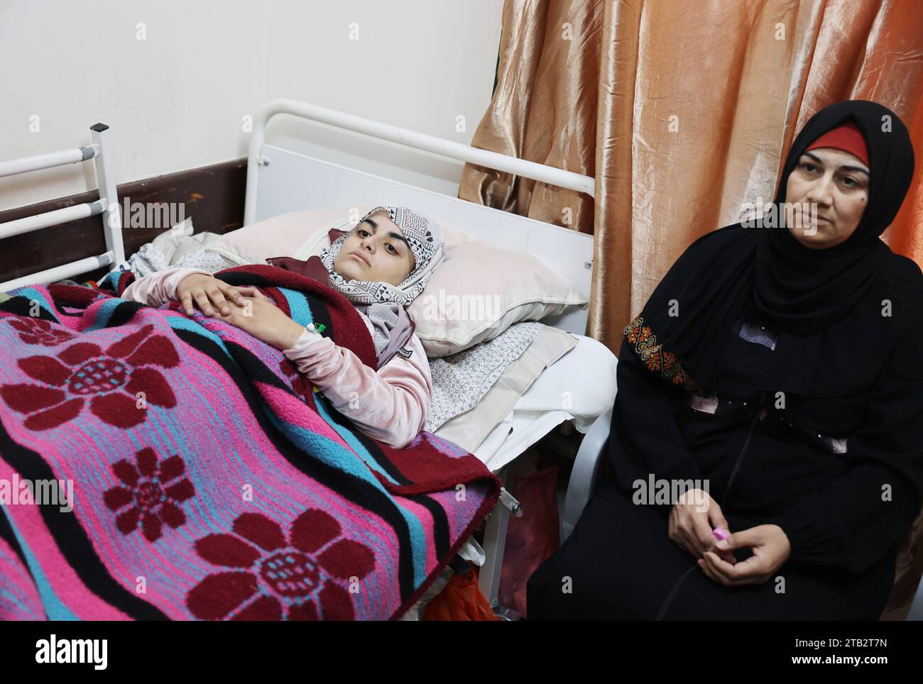 Palestinian Samah Mohsen, sitting with her mother and sister in Al-Aqsa ...