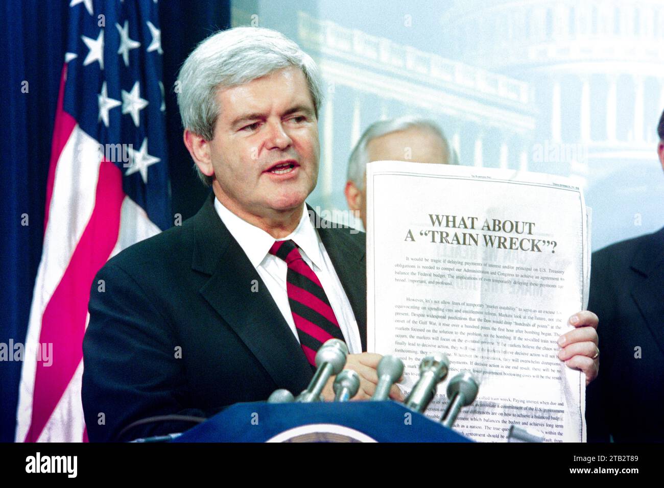 U.S Speaker Rep. Newt Gingrich hold up a newspaper headline on the ...