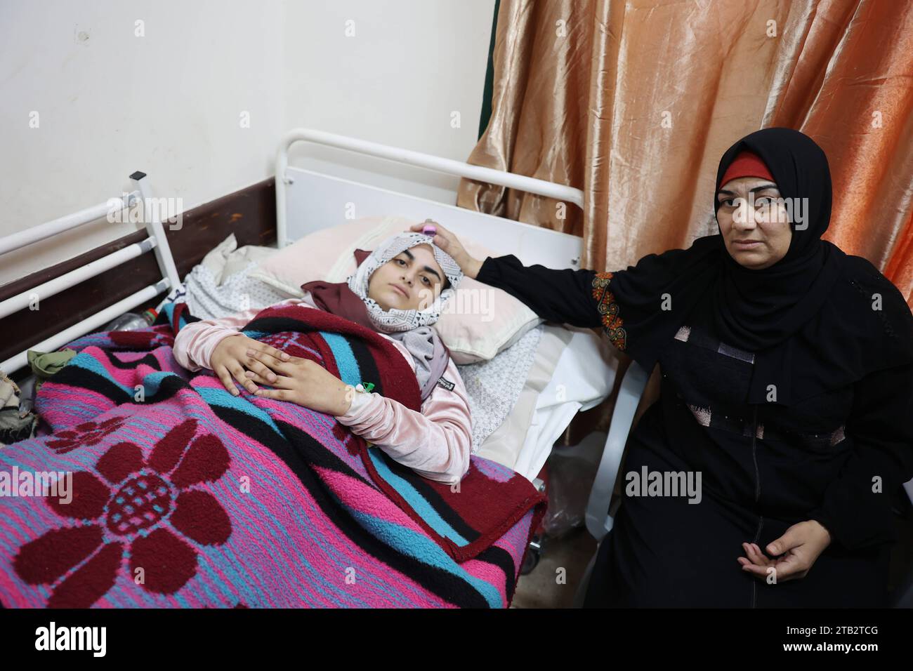 Palestinian Samah Mohsen, sitting with her mother and sister in Al-Aqsa ...