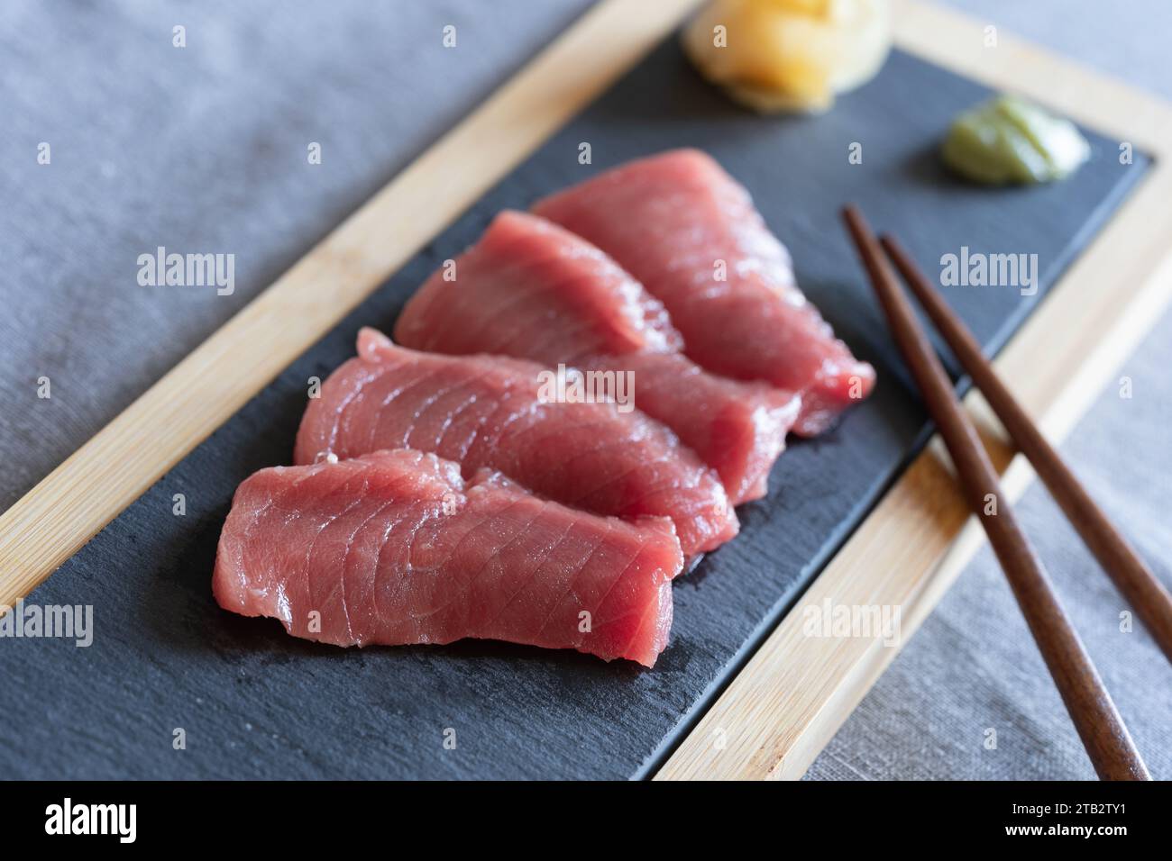 Japanese style home eating - homemade raw Akami tuna sashimi on a slate ...