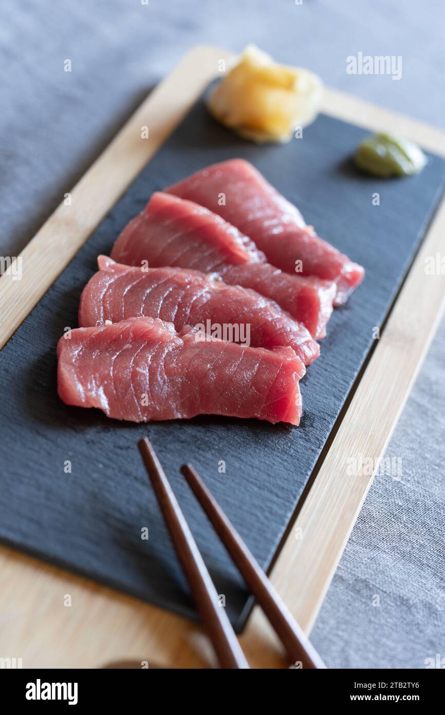 Japanese style home eating - homemade raw Akami tuna sashimi on a slate ...