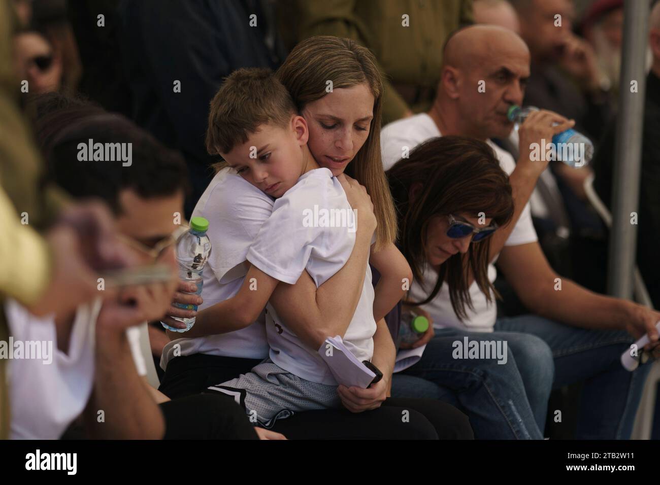 Relatives of Israeli Col. Asaf Hamami mourn during his funeral at the ...