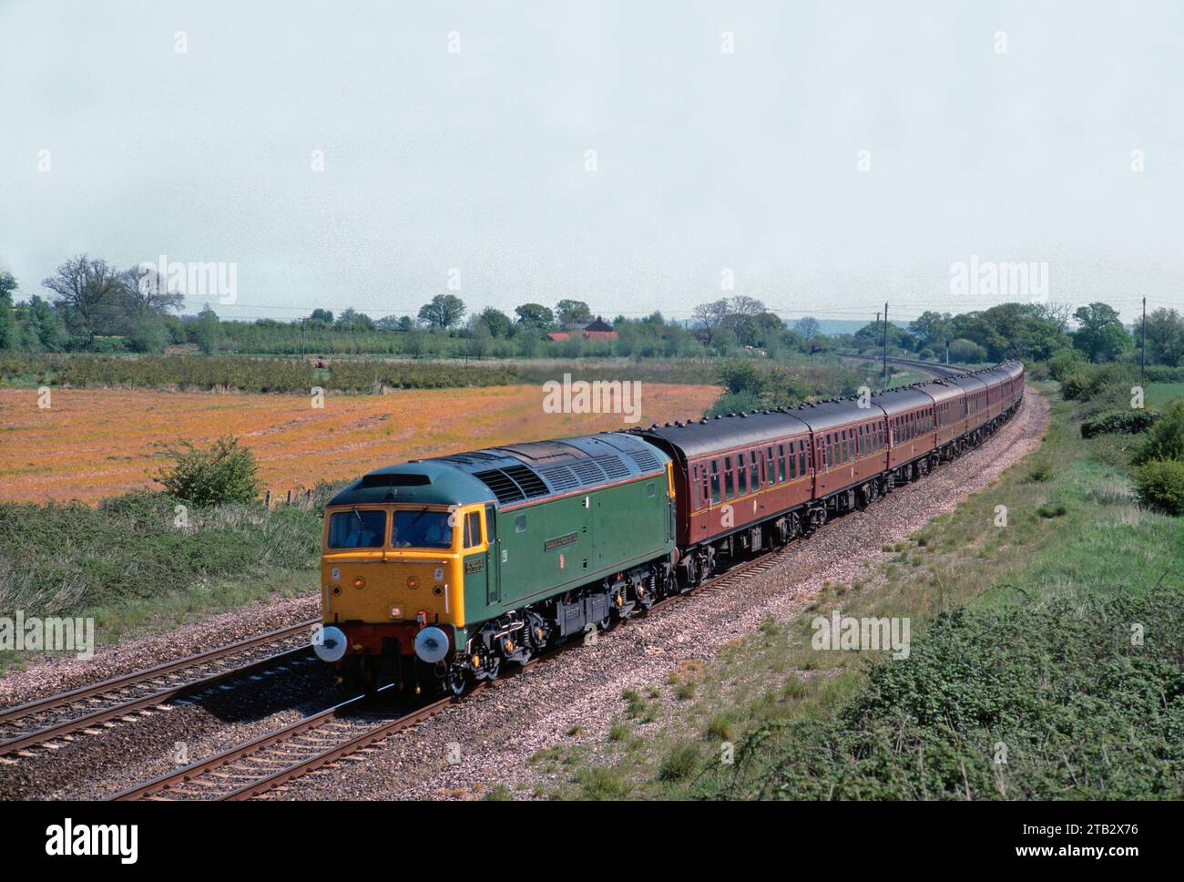 A Class 47 diesel locomotive number 47484 in lined green livery working ...