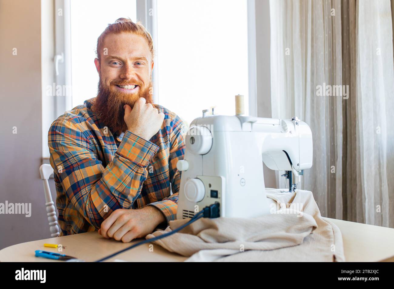Man sews sewing machine designer hi-res stock photography and images ...