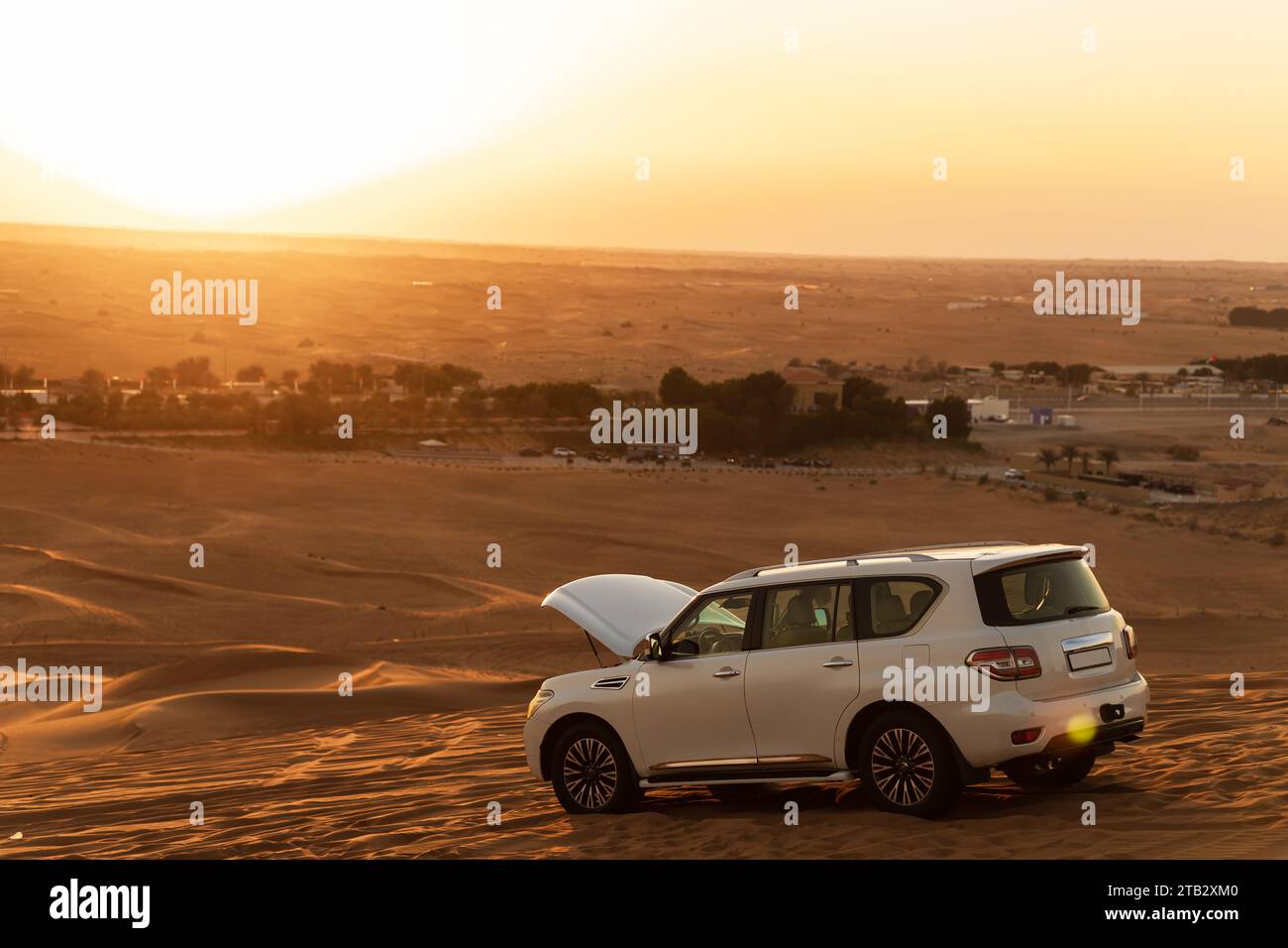 White car driving in Rub al Khali Desert at the Empty Quarter, in Abu ...
