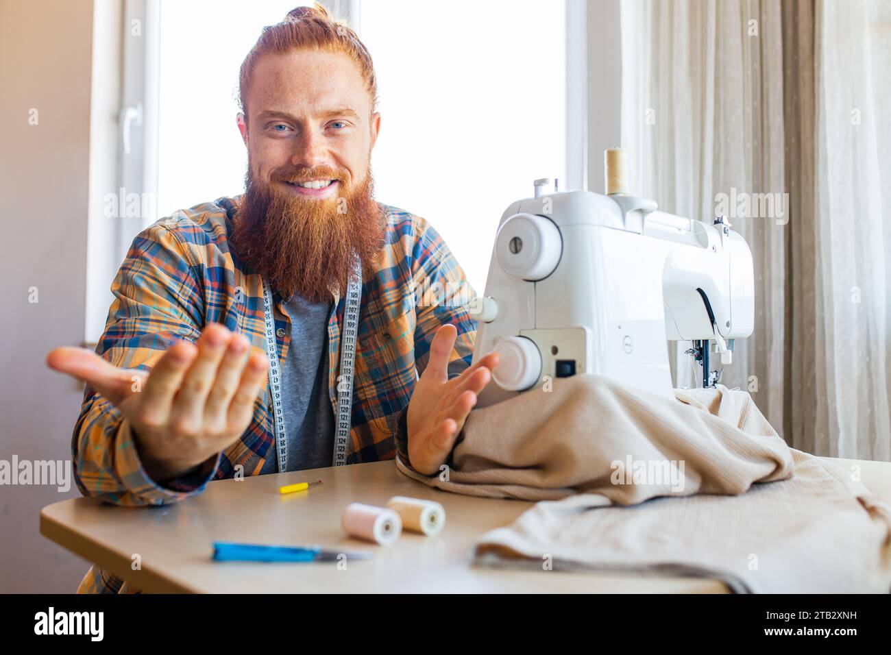 Man sews sewing machine designer hi-res stock photography and images ...