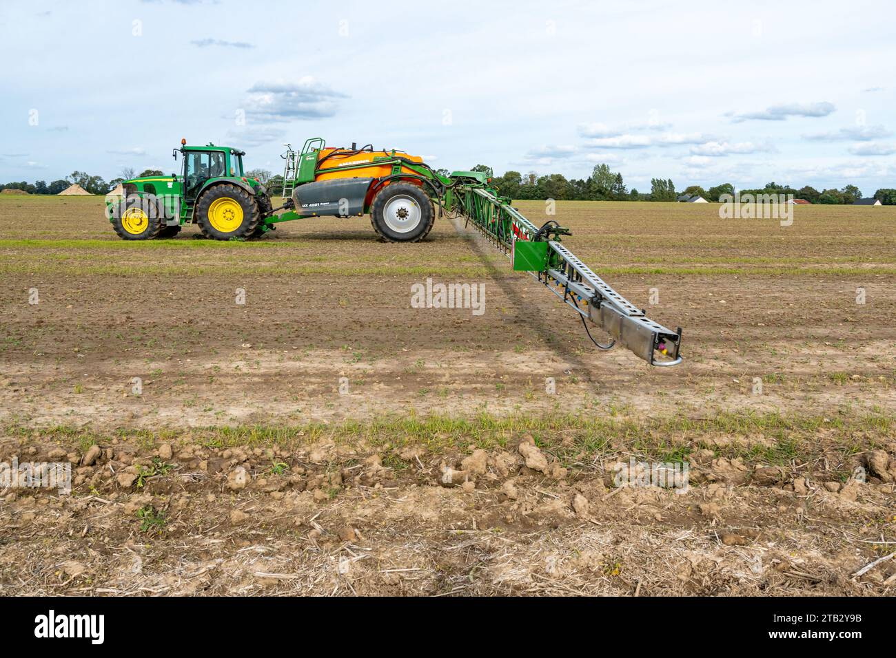 Spreading trace elements on a newly sown rapeseed field. John Deere ...