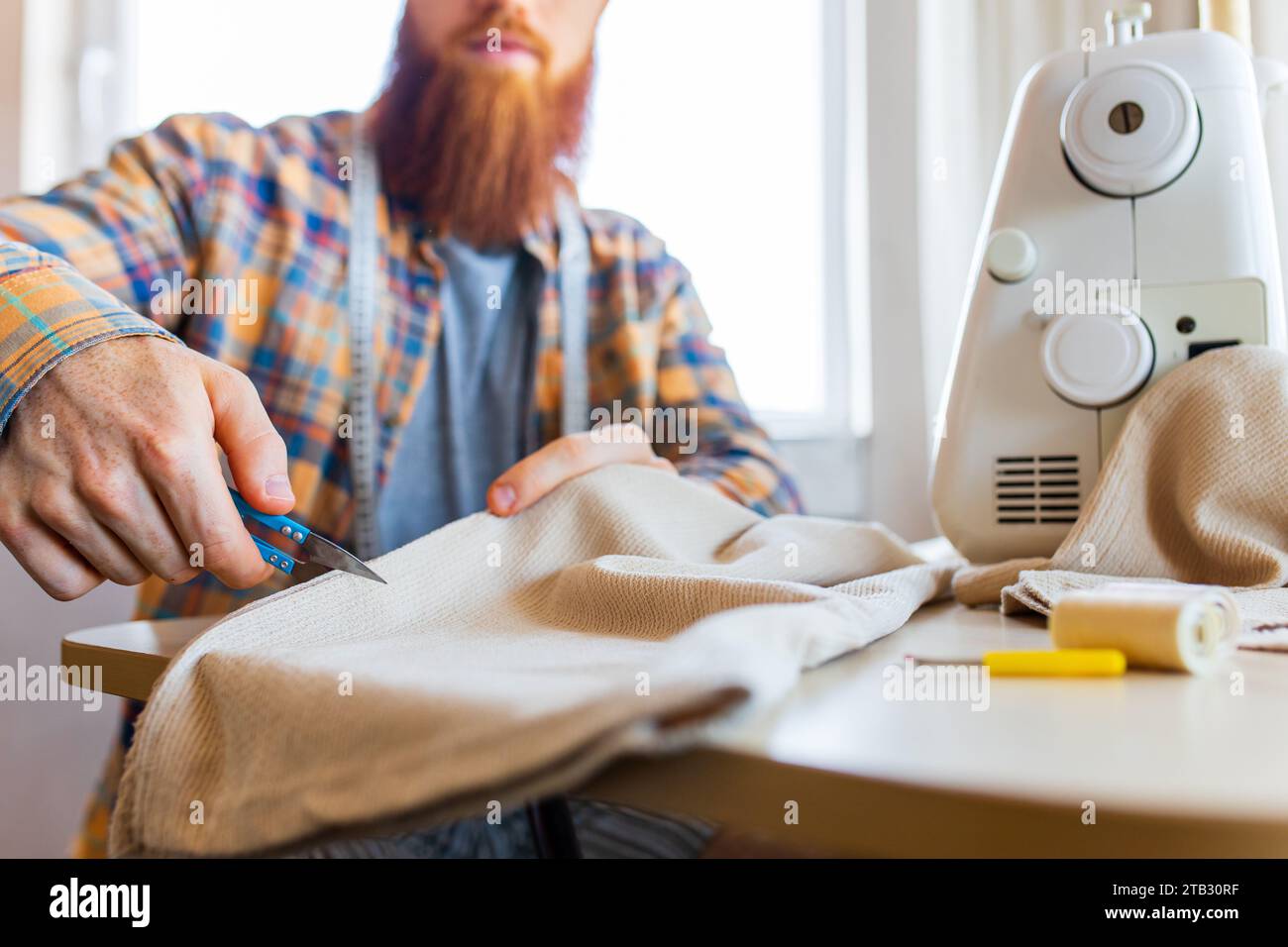 Man sews sewing machine designer hi-res stock photography and images ...