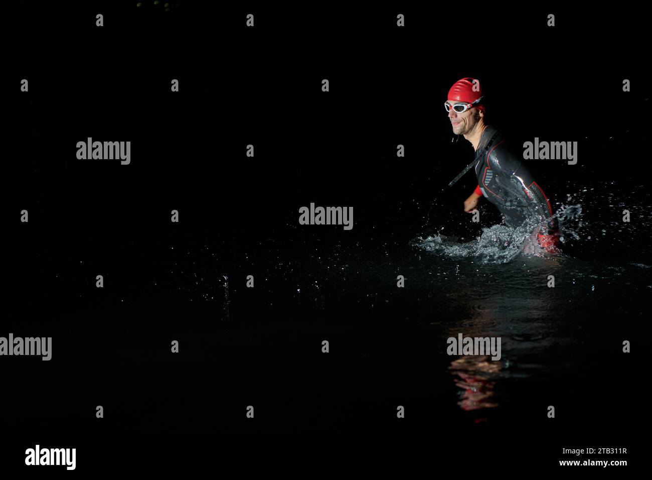 A determined professional triathlete undergoes rigorous night time ...