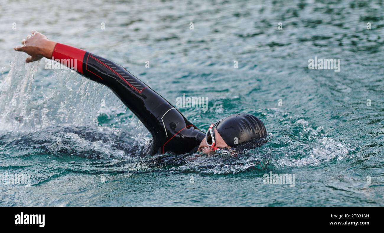 A professional triathlete trains with unwavering dedication for an ...