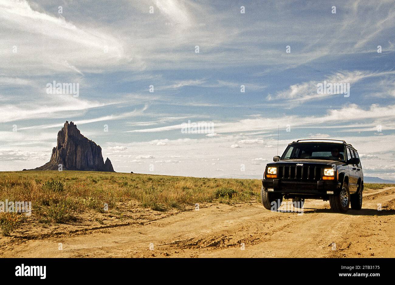 Jeep Cherokee with Ship rock in the Navajo reservation in the ...