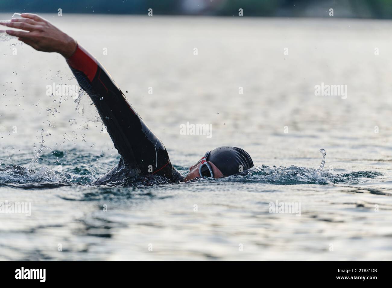 A professional triathlete trains with unwavering dedication for an ...