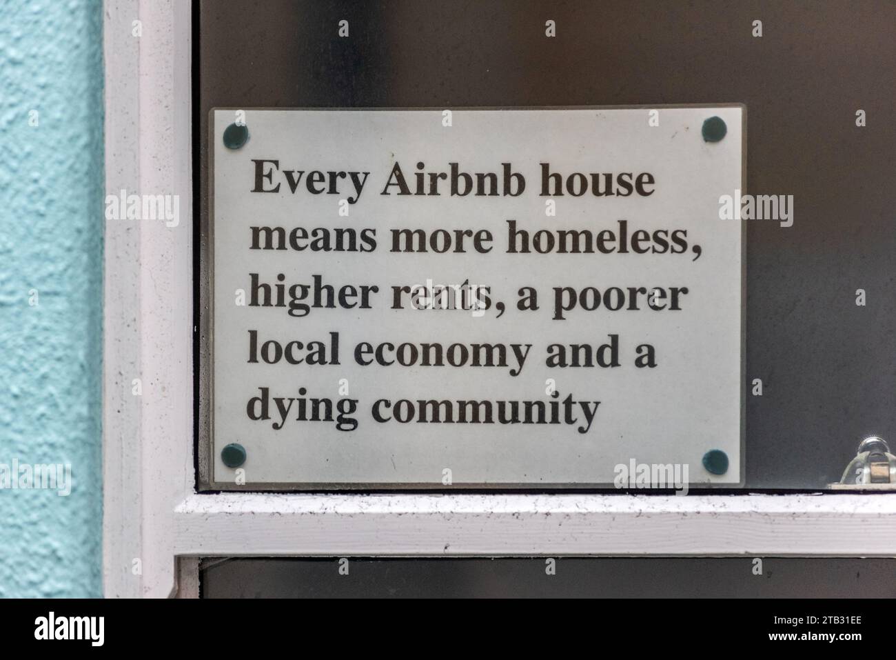 Brighton, December 4th 2023: Anti Air BnB posters in the window of a ...