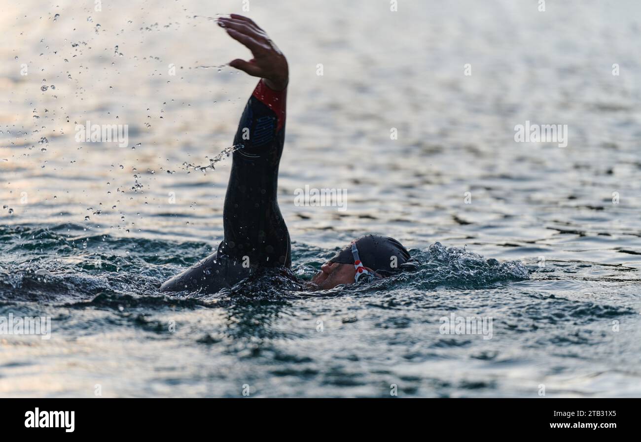 A professional triathlete trains with unwavering dedication for an ...