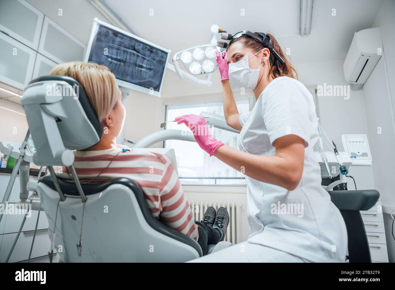 Dental clinic patient visit modern medical ward. Dentist female doctor ...