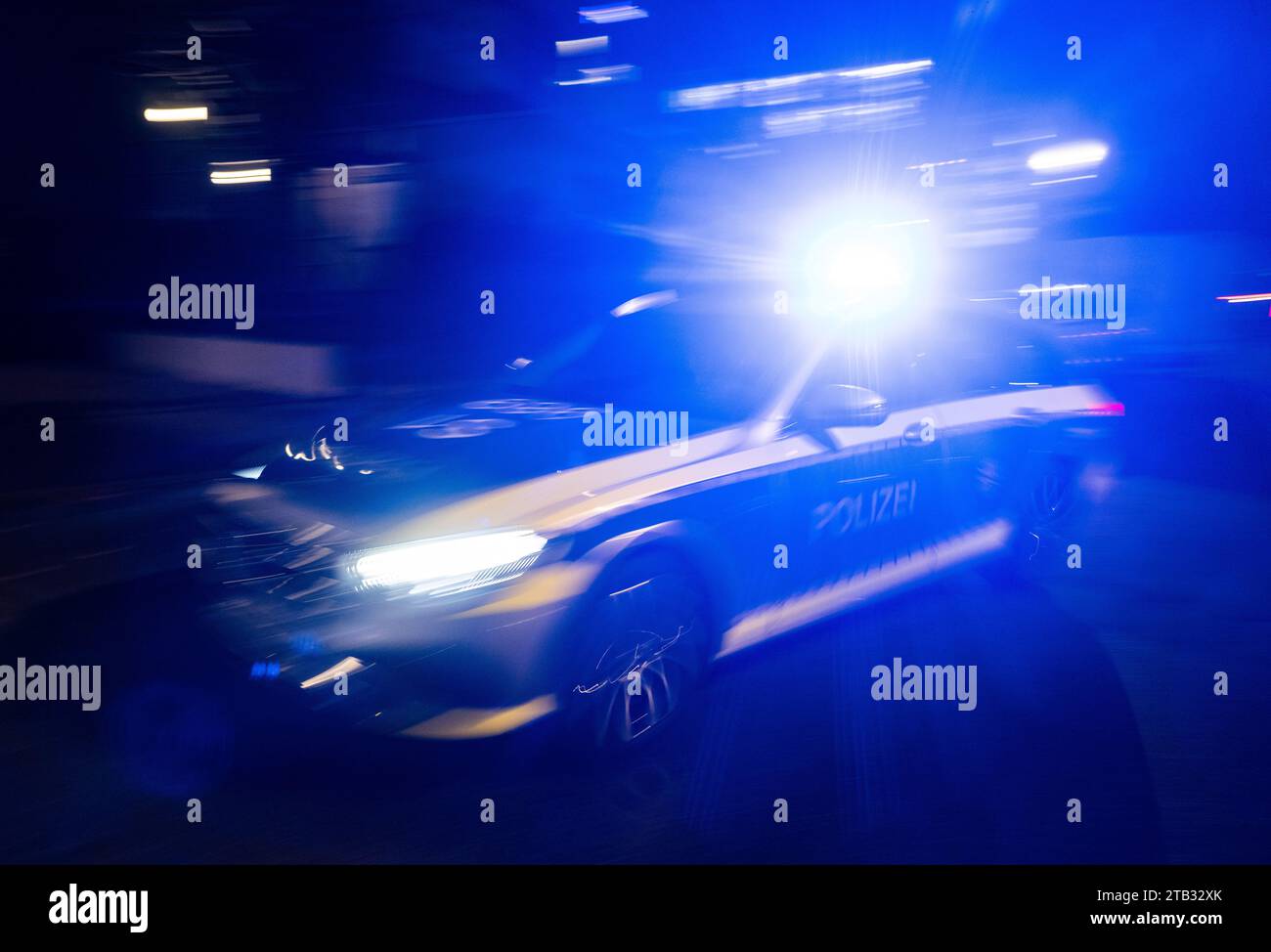 Stuttgart, Germany. 30th Nov, 2023. A police car drives past a building ...
