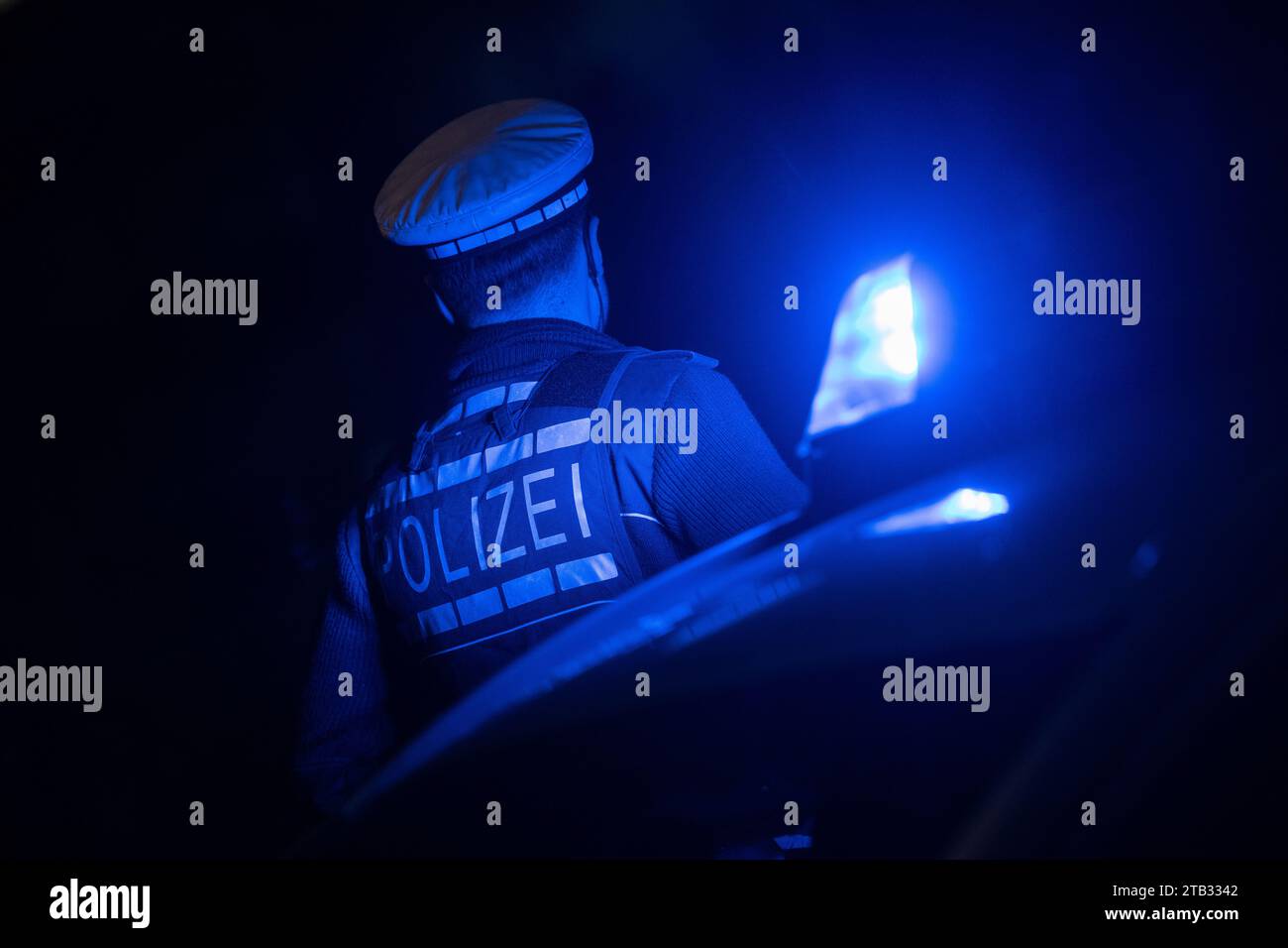 Stuttgart, Germany. 30th Nov, 2023. A police officer stands next to a ...