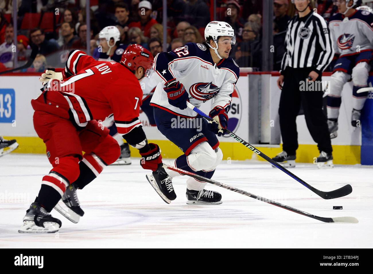 Columbus Blue Jackets' Alexandre Texier (42) drives the puck away from ...