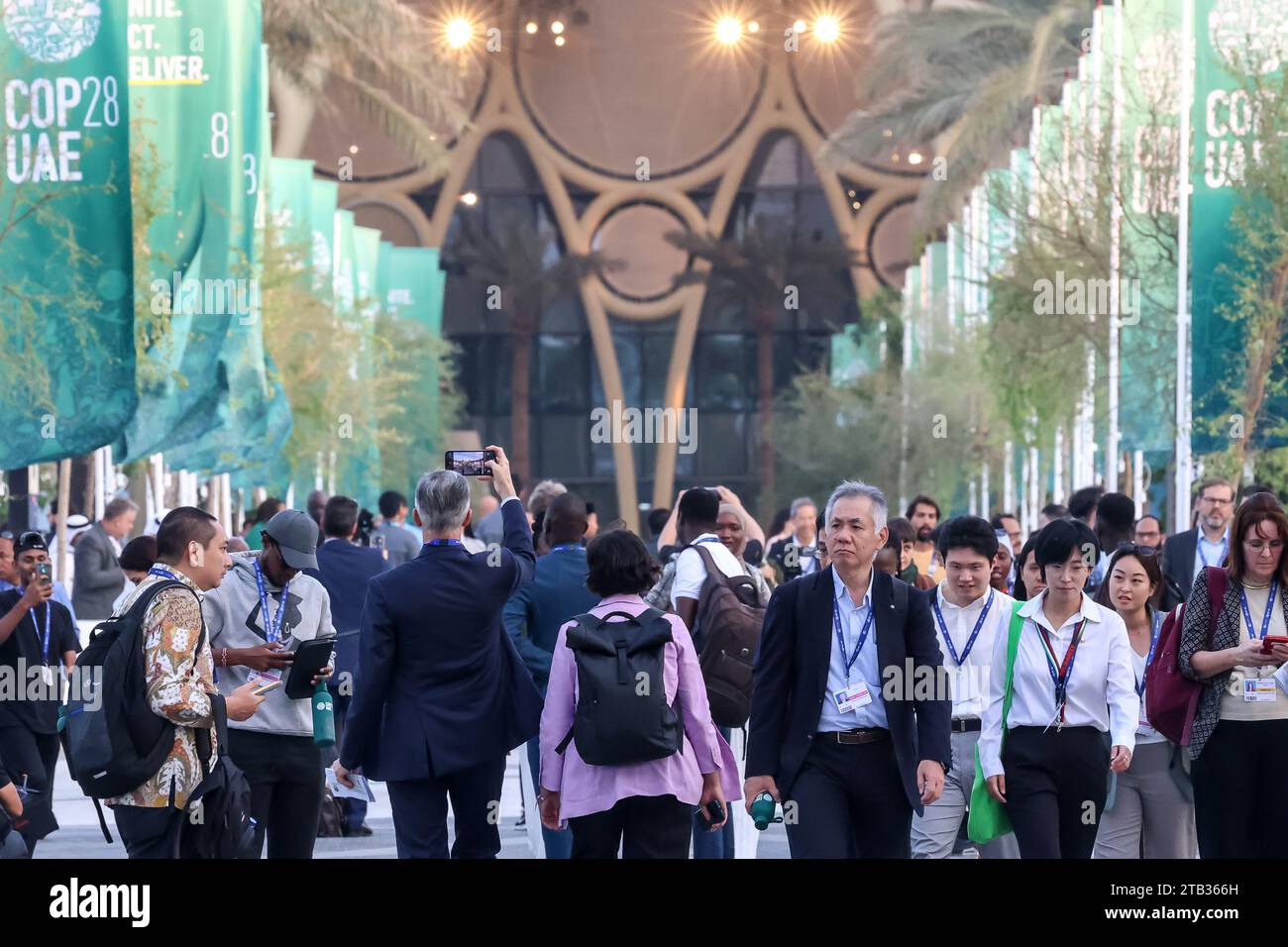 Participants walk on the allies of conference venue during the COP28 ...