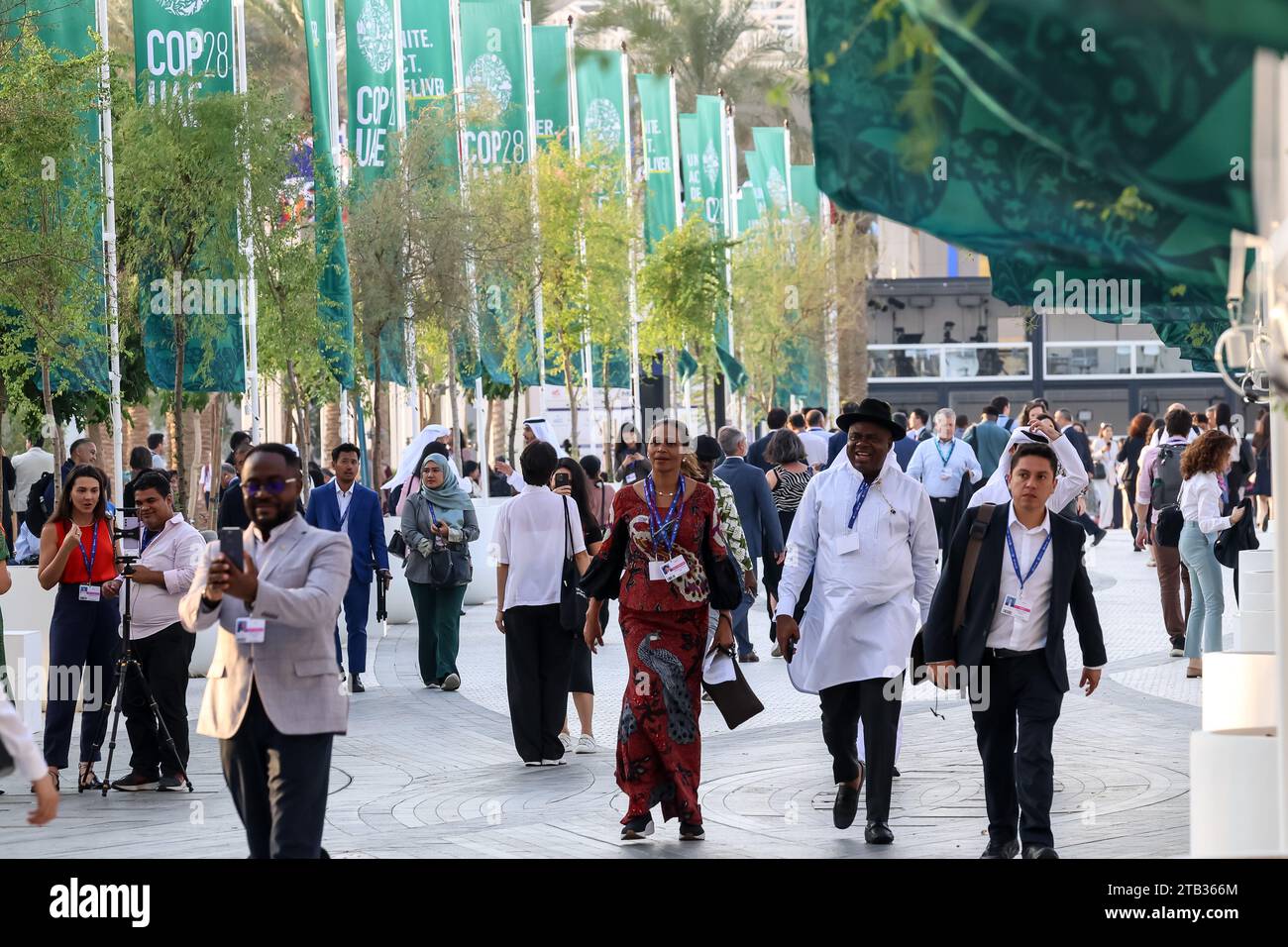 Participants walk on the allies of conference venue during the COP28 ...