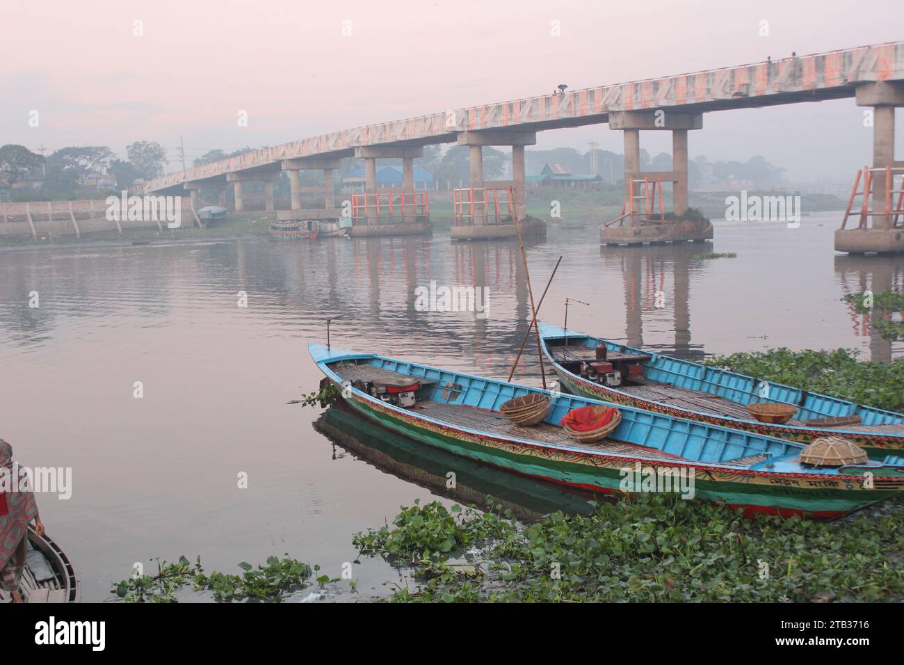 a landscape view of local bridge on the river in Bangladesh, in the ...