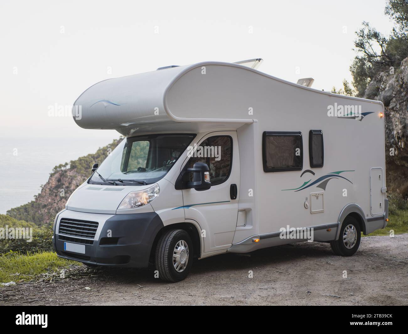White over cab coachbuilt motor home outdoors Stock Photo - Alamy