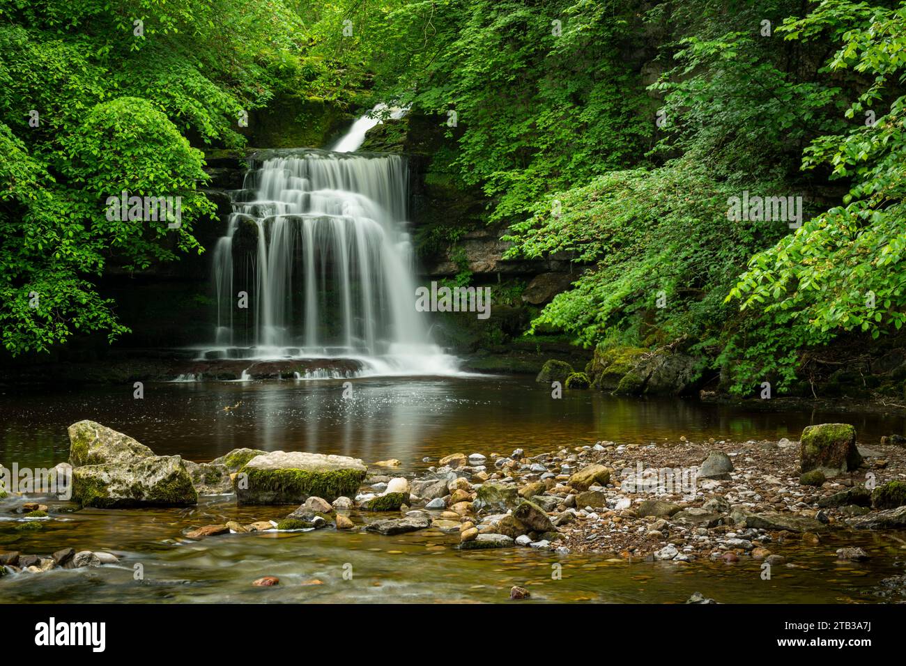 Cauldron Falls waterfall in the village of West Burton, Yorkshire Dales ...