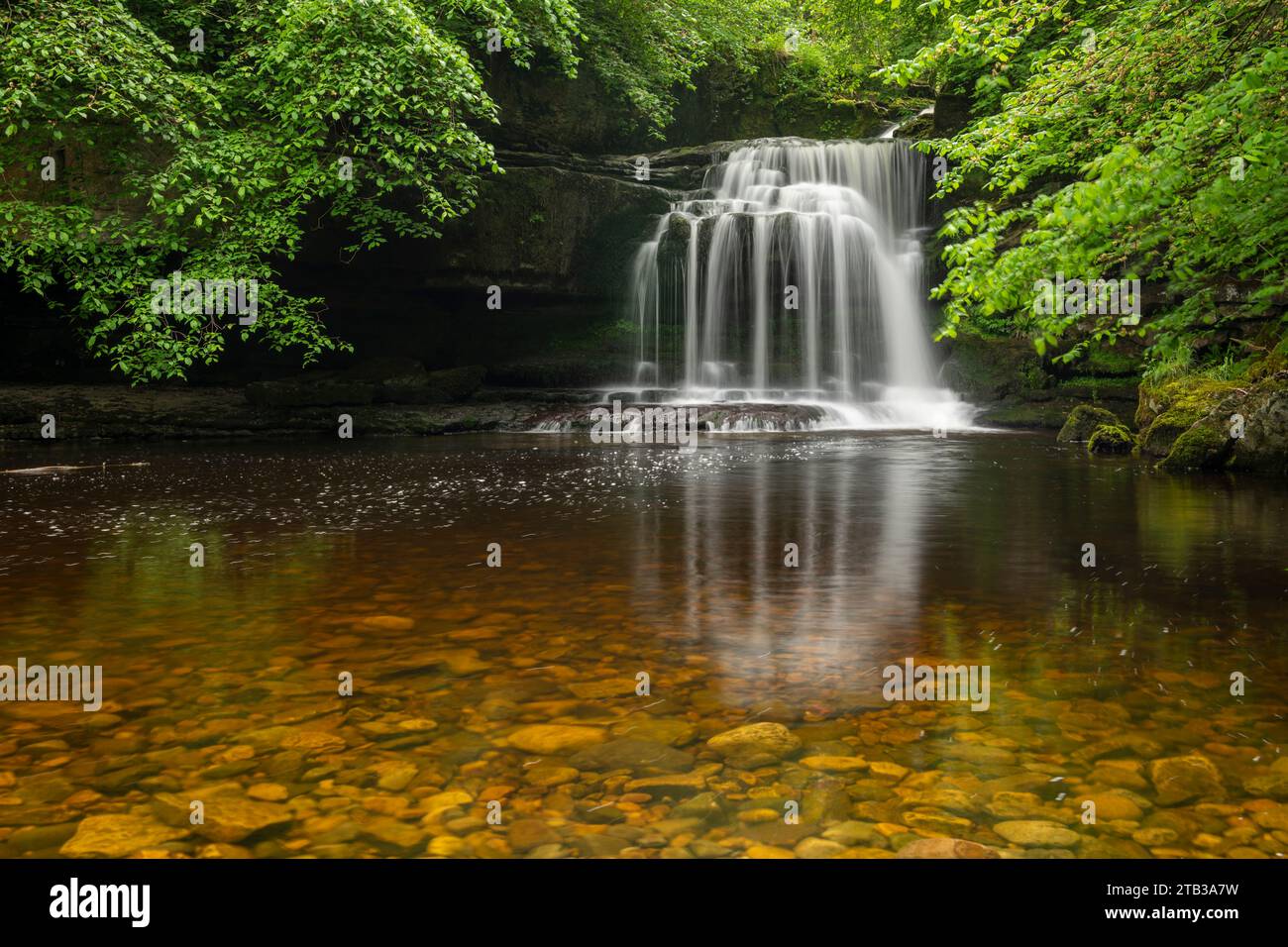 Cauldron Falls waterfall in the village of West Burton, Yorkshire Dales ...