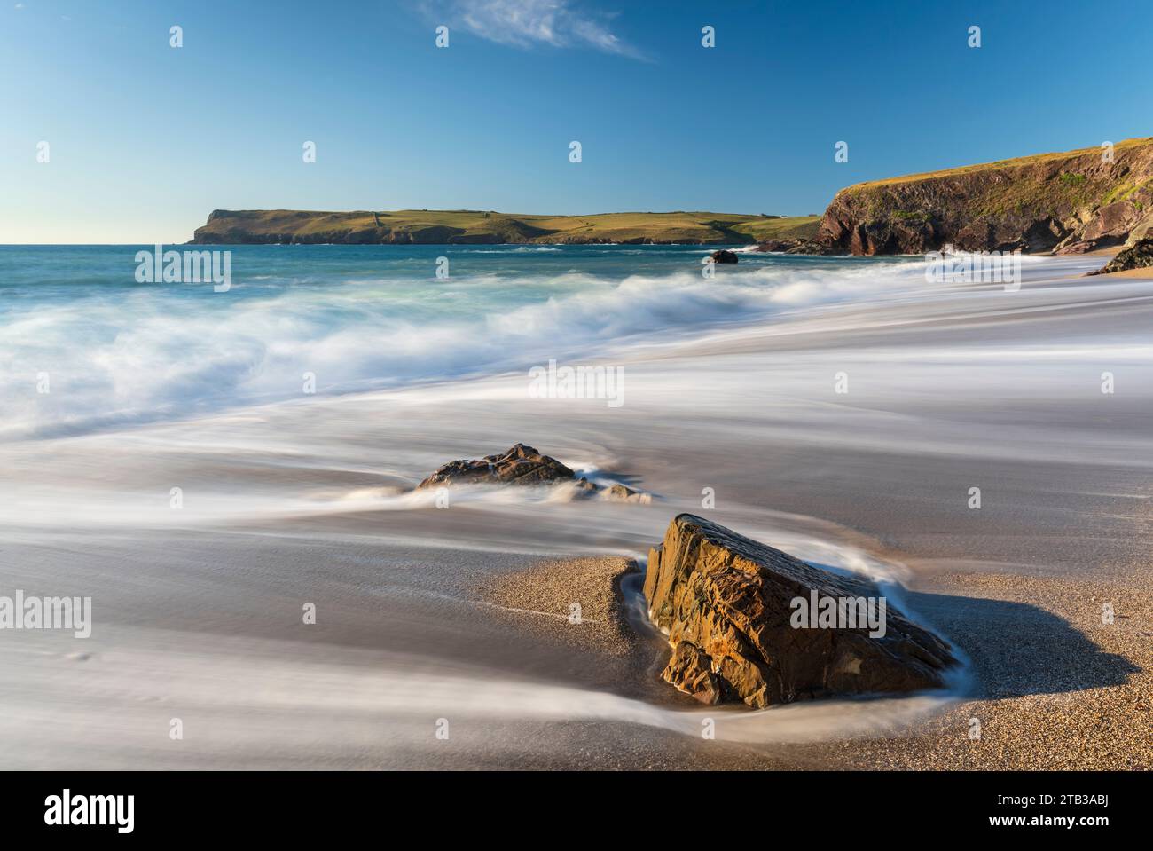 Waves surge onto Greenaway Beach near Polzeath, Cornwall, England ...