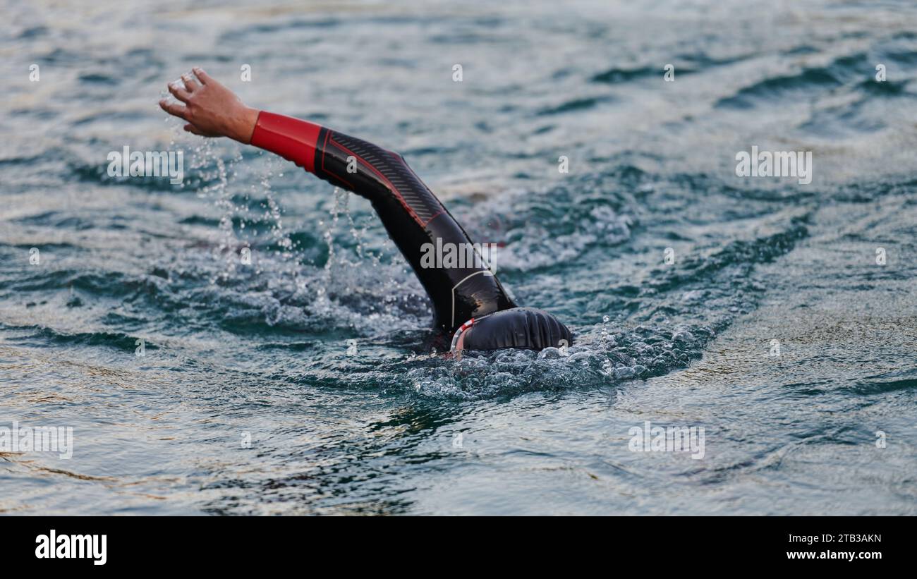 A professional triathlete trains with unwavering dedication for an ...