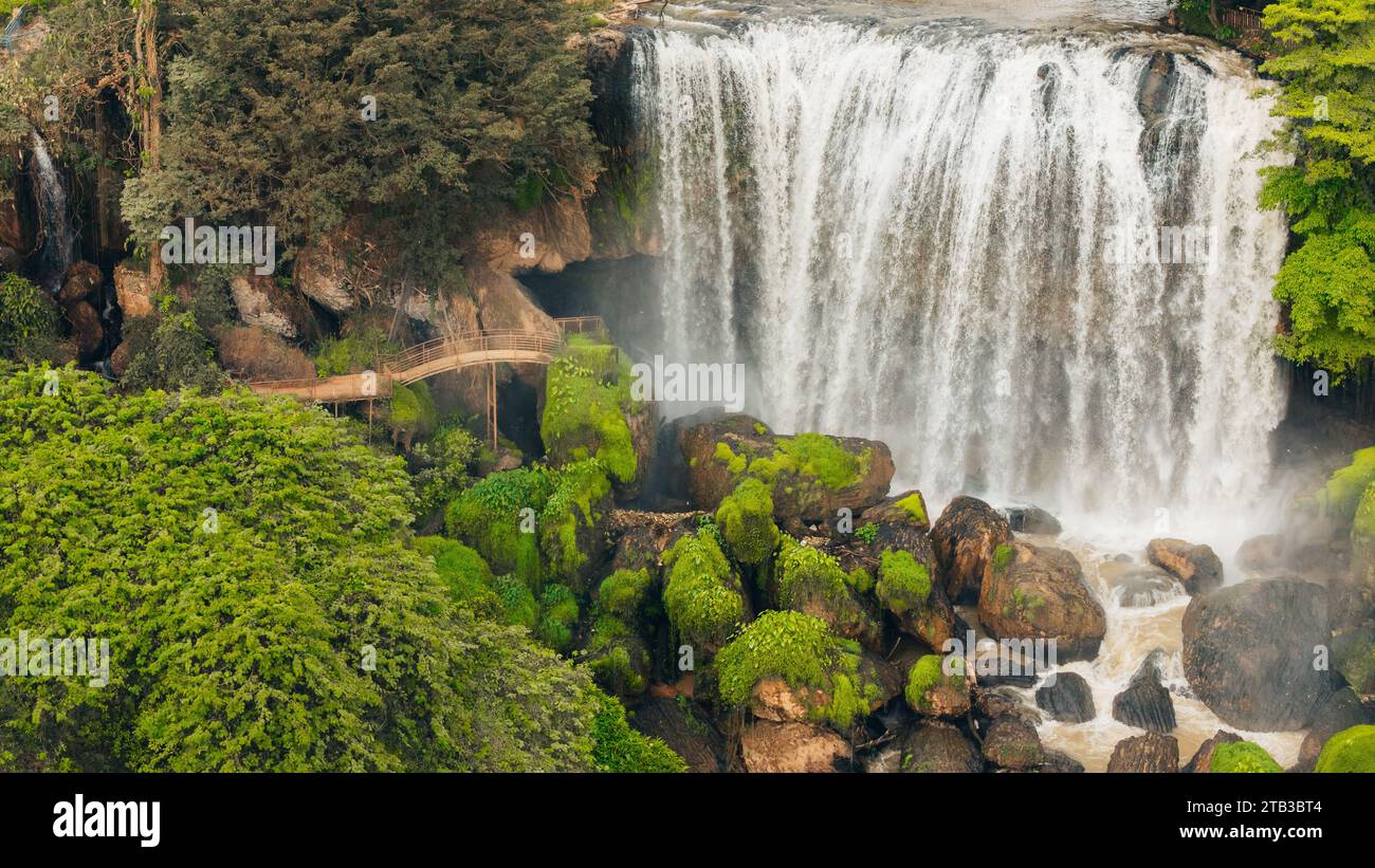 Aerial view of Thac Voi - Elephant waterfall, forest and city scene ...