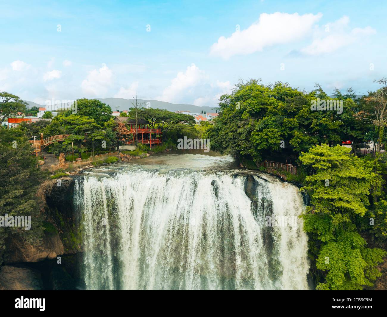 Aerial view of Thac Voi - Elephant waterfall, forest and city scene ...