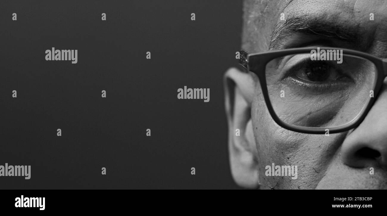 deafness suffering from hearing loss on grey black background with ...