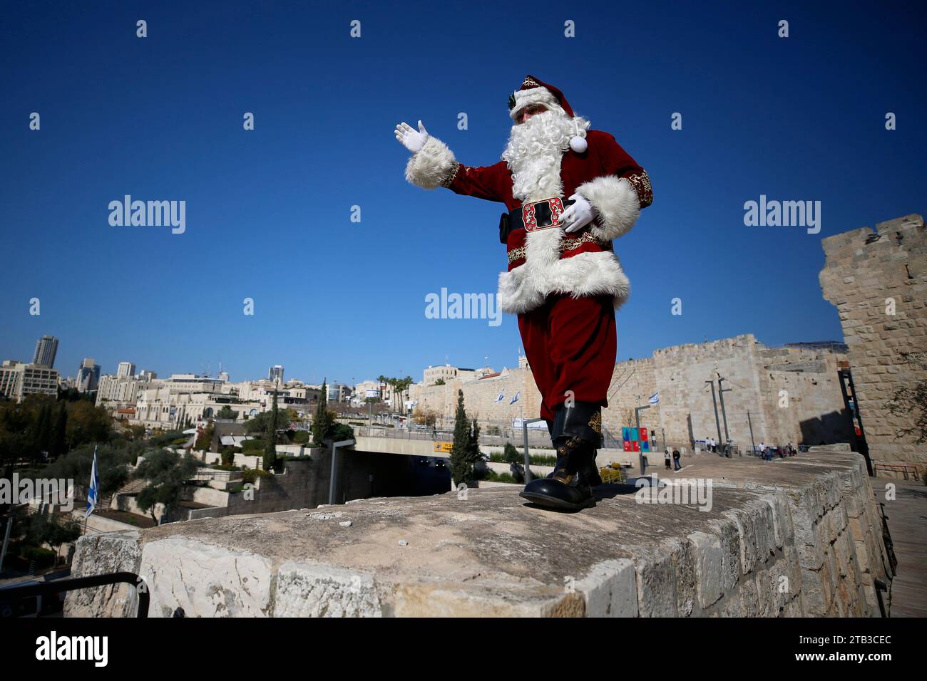 Palestinian Issa Qassisieh, dressed as Santa Claus, poses for a photo ...
