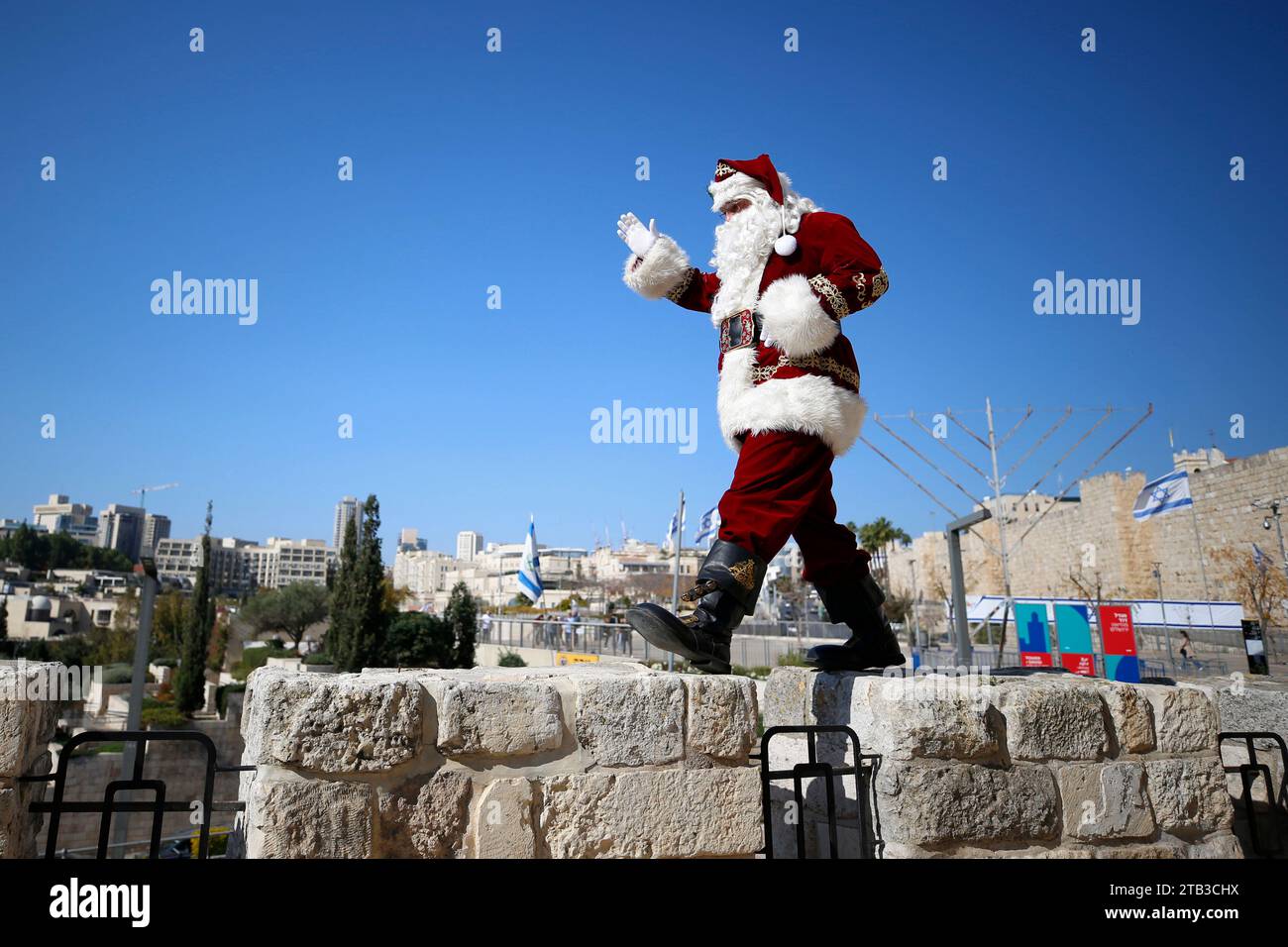 Palestinian Issa Qassisieh, dressed as Santa Claus, poses for a photo ...