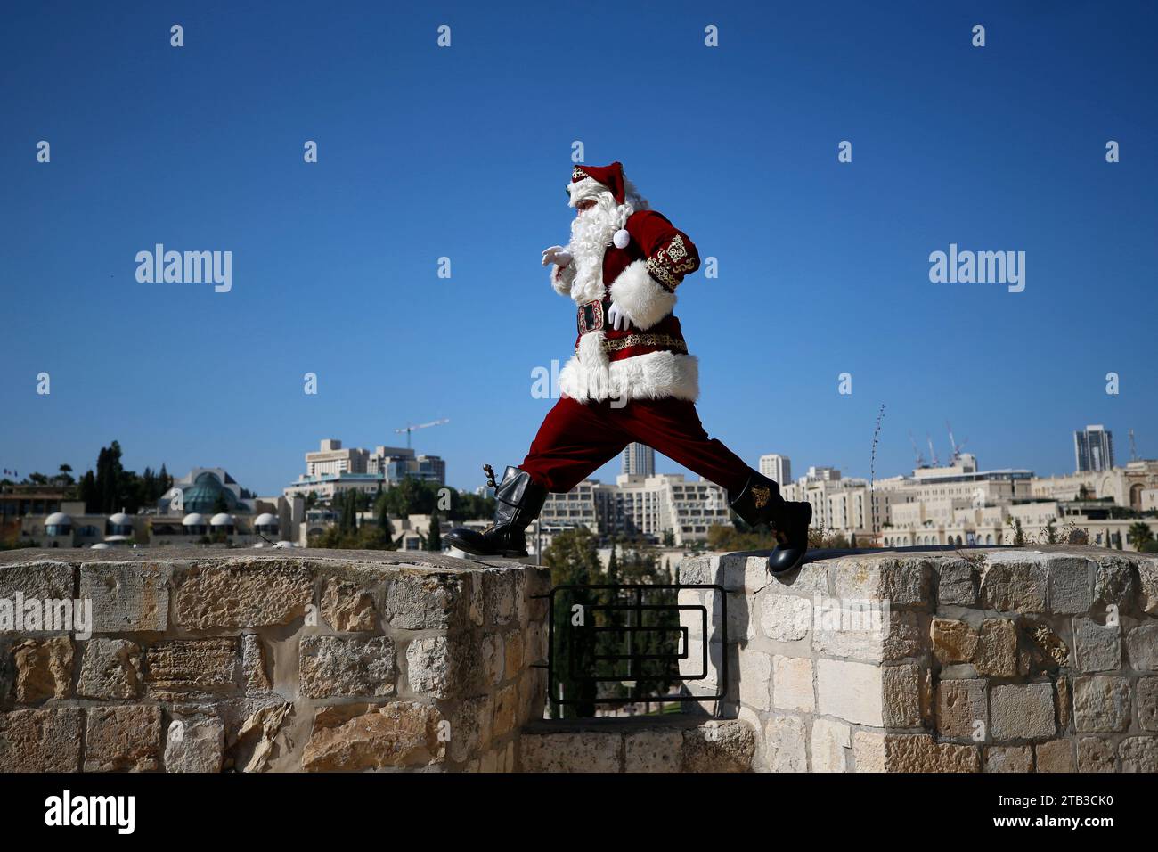 Palestinian Issa Qassisieh, dressed as Santa Claus, poses for a photo ...