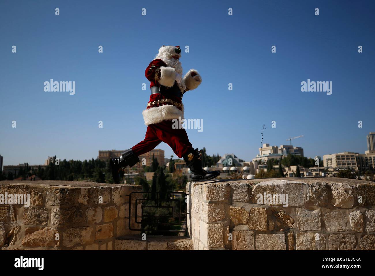 Palestinian Issa Qassisieh, dressed as Santa Claus, poses for a photo ...