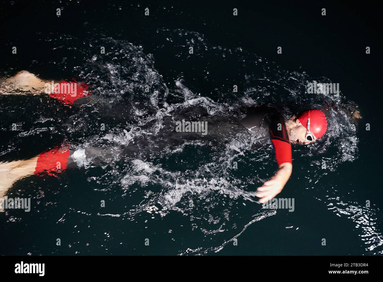 A determined professional triathlete undergoes rigorous night time ...