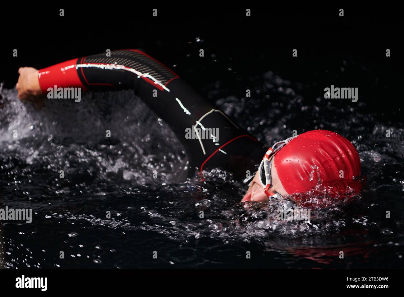 A determined professional triathlete undergoes rigorous night time ...