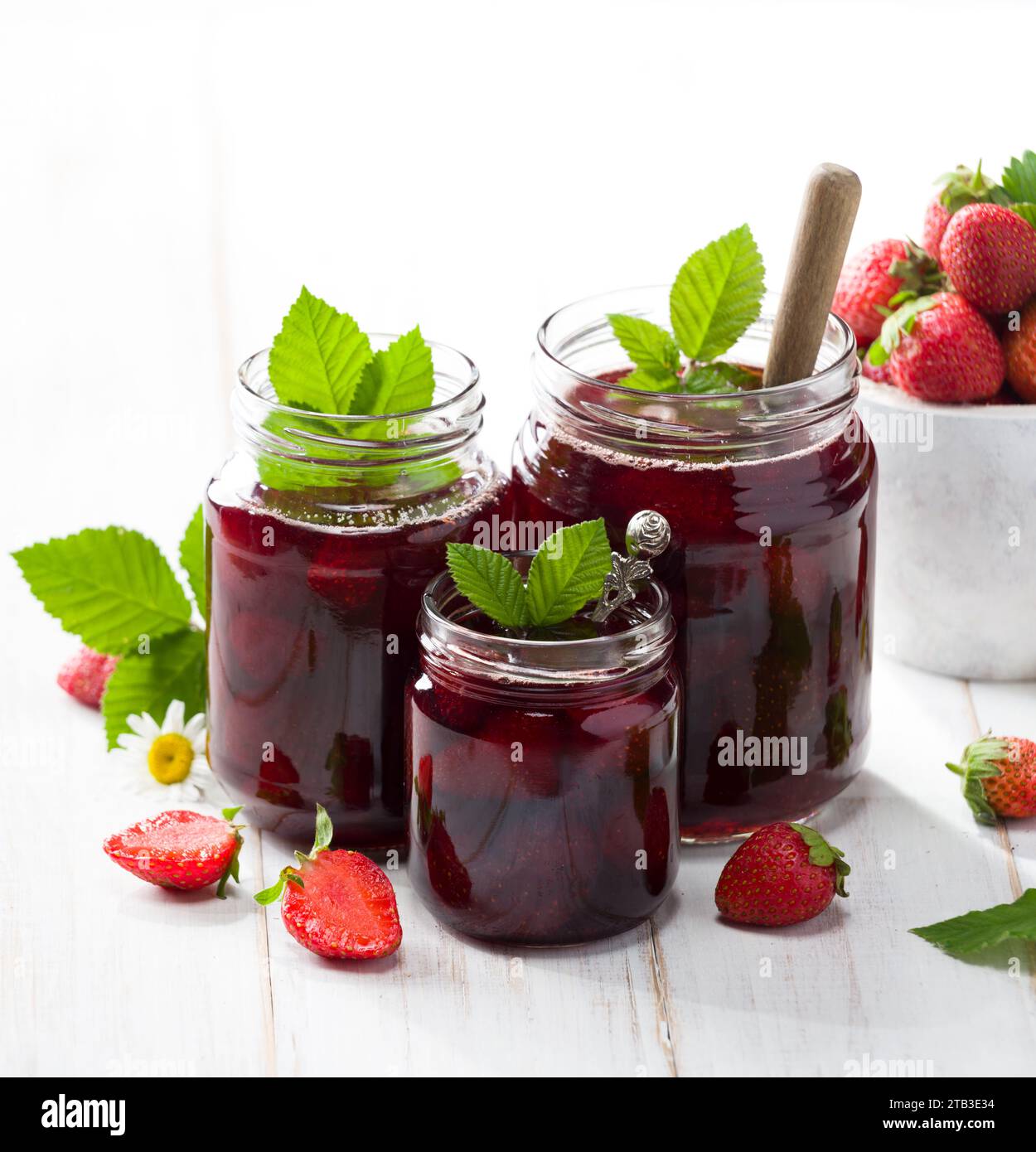 Fresh strawberry jam. Jars of homemade strawberry jam on the table ...